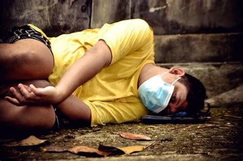 Premium Photo Full Length Of Man Sleeping On Street Against Wall