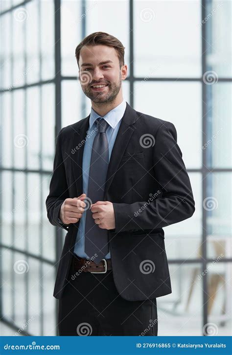 Portrait Of A Happy Man Wearing Glasses And Looking At The Camera