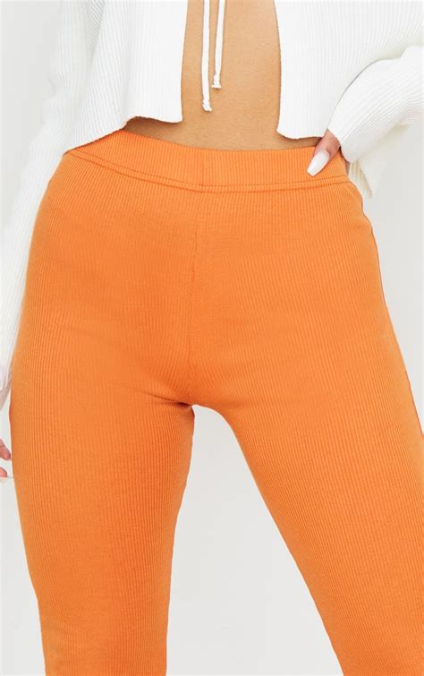 Burnt Orange Ribbed Flared Trousers Prettylittlething