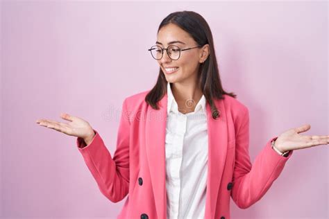 Young Hispanic Woman Wearing Business Clothes And Glasses Smiling