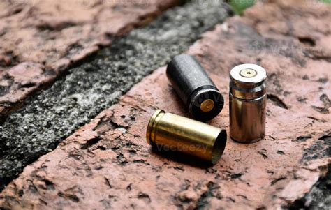 9mm Pistol Bullet Shells On Brick Floor Soft And Selective Focus