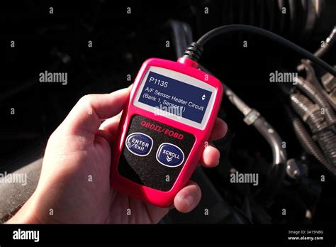Obd Or Obd Ii Scanner In Use By Technician Automotive Diagnostic Tool In Use For Scanning