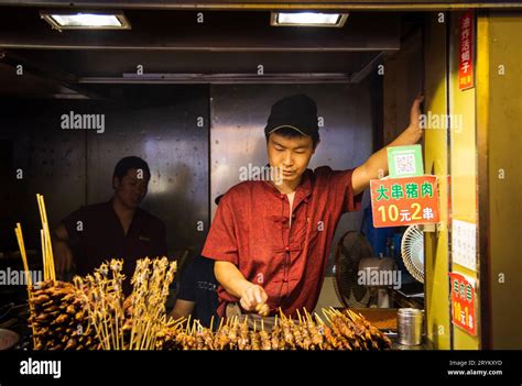Chinese Chef Cooking Traditional On The Snack Street In Beijing China