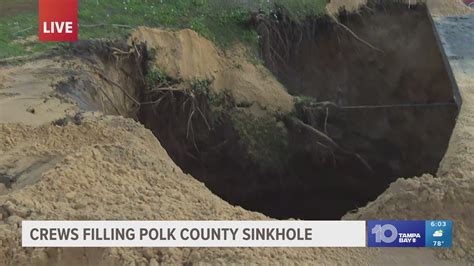 Crews Start Filling 60 Foot Sinkhole In Polk County Yard