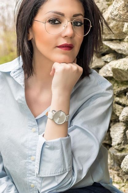 Premium Photo Portrait Of Beautiful Woman Against Wall