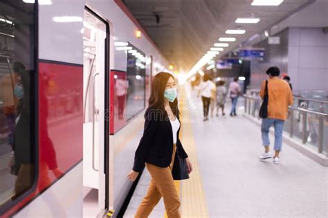 Asian Women Getting Off A Train At Stationtransport And Train Concept