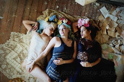 Three Young Woman Cuddle Side By Side By Stocksy Contributor Peyton