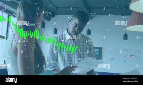 Image Of Changing Numbers And Graphs Over Diverse Coworkers Discussing