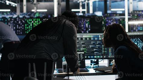 Data Center Colleagues Using Node Tree Program To Identify Equipment