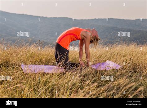 Beautiful Woman Doing Yoga In The Nature Ustrasana Advanced Camel Pose