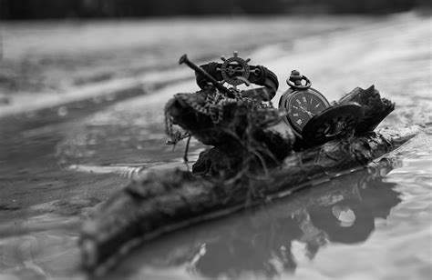 A Tiny Boat Is Floating On The Water Photo Free See Image On Unsplash