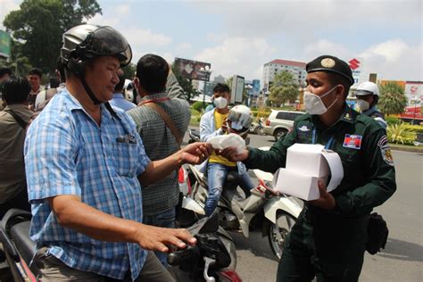 H E Khuong Sreng Distributes Facemasks To Passengers In Phnom Penh