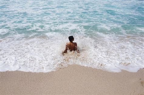 Premium Photo Rear View Of Shirtless Man On Beach