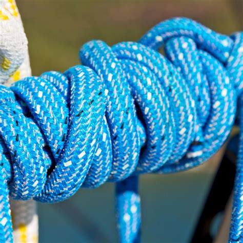 Premium Photo Close Up Of Blue Rope Tied To Metal