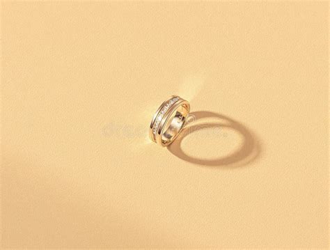 Elegant Gold Ring On Sand A Symbol Of Love And Commitment Stock
