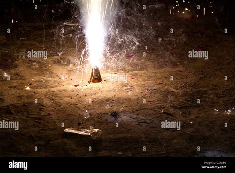 Lighted Firecracker And Discarded Packaging At The Festival Of Diwali