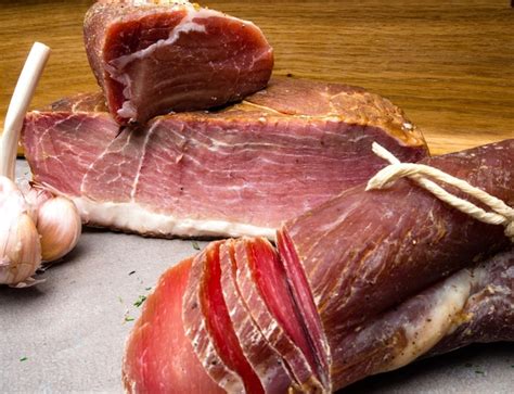 Premium Photo Group Of Smoked Ham Jerky Salted Biltong Meat With Some Garlic And Herbs