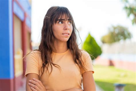 Premium Photo Young Woman At Outdoors With Confuse Face Expression