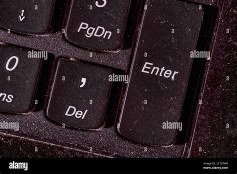 A Computer Keyboard Focus On Enter Button Black Background Stock Photo Alamy