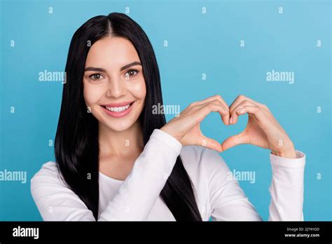 Photo Of Pretty Brunette Millennial Lady Show Heart Wear Outfit