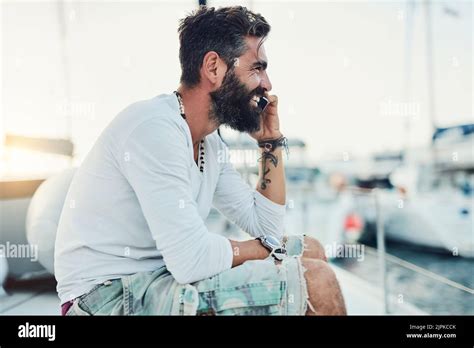 making a call before he sets sail a man talking on his phone while