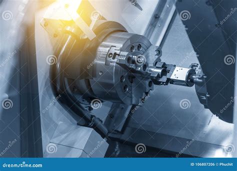 The CNC Lathe Machine With The Robot Arm Stock Photo Image Of Cutter Factory