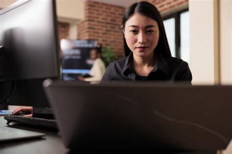 Asian Tech Enginner Analyzing Compiling Html Code Stock Photo 25125406