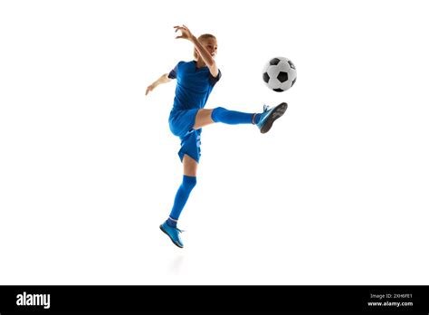 Dynamic Image Of Teen Girl Football Player In Motion Kicking Ball