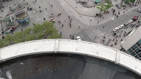 Elevated Perspective Of Urban Intersection With Pedestrians And Vehicles Navigating Stock Video