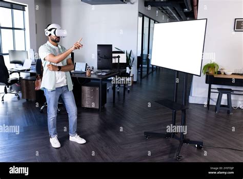 Using Vr Headset Indian Man Interacting With Virtual Screen In Modern Office Copy Space Stock