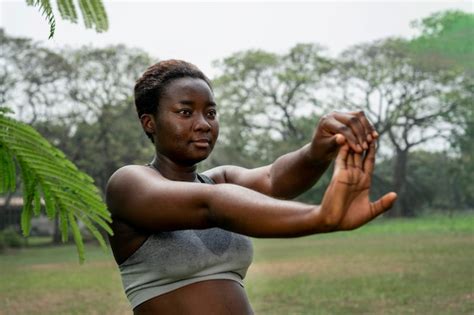 Free Photo Portrait Sporty Woman In Nature Stretching