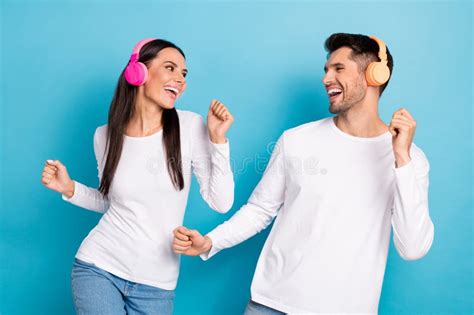 Portrait Of Two Overjoyed Positive Partners Listen Music Dancing Have