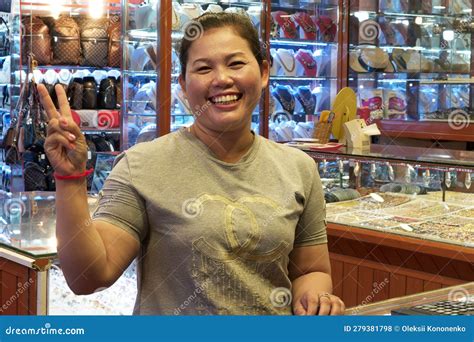 Smiling Cambodian Asian Girl In Traditional Dress At Angkor Wat Temple