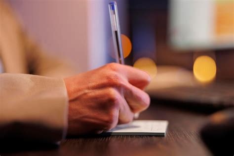 Free Photo Businesswoman Writing Company Profit Progress On Stickey