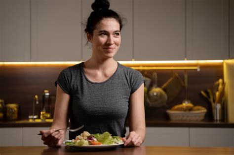 Free Photo Woman Trying To Eat Healthy At Home