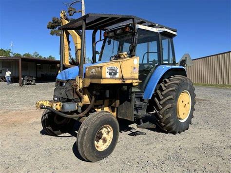 TS100 New Holland 2 WD Tractor Cab With Bengal Tiger Side Boom Mower