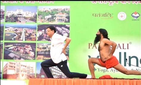 free photo international yoga day cm dhami did yoga with baba ramdev