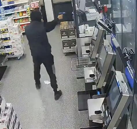 Moment Armed Robber Threatens Shop Workers With Gun In North London