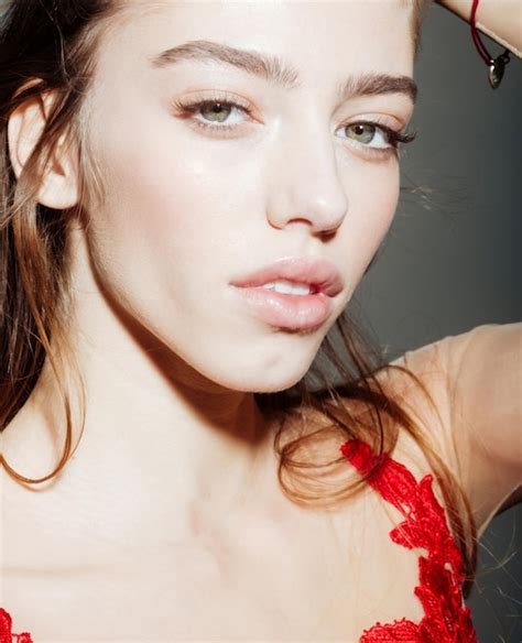 Pretty Sexy Woman With Long Hair In Red Embroidered Bodysuit Premium