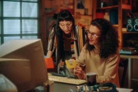 Premium Photo Young People Using Floppy Disk To Save Information From