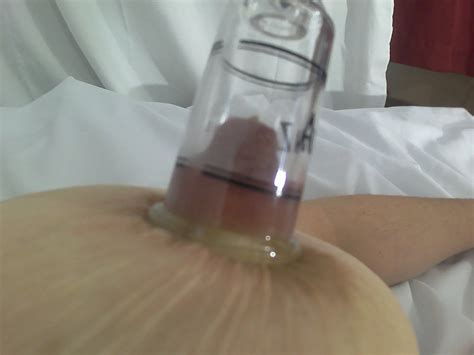 Kinky Brunette Chick Having Some Fun With A Pump Photos