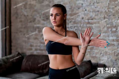 Fit Young Woman In Sportswear Doing Shoulder And Arm Stretching