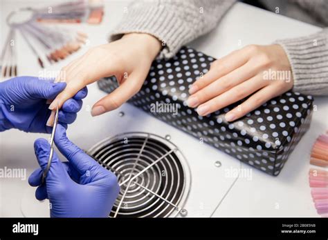 Manicurist Cut Cuticle Scissors Tool On Nails Of Client Girl Top View Stock Photo Alamy
