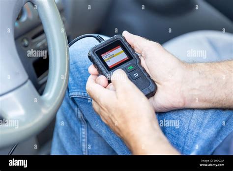 Using Diagnostic Car Code Reader To Reset Error Codes And Turn Off Check Engine Light Stock