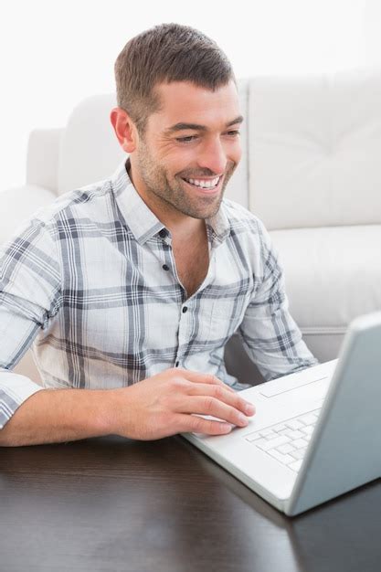 Premium Photo Smiling Man On A Laptop
