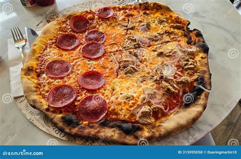 Californiastyle Tuna Pizza Topped With Salami Pepperoni And Mushrooms