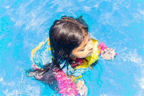 Premium Photo High Angle View Of Girl Swimming In Pool