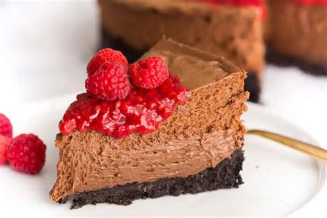 Chocolate Cheesecake With Raspberry Sauce Greens And Chocolate