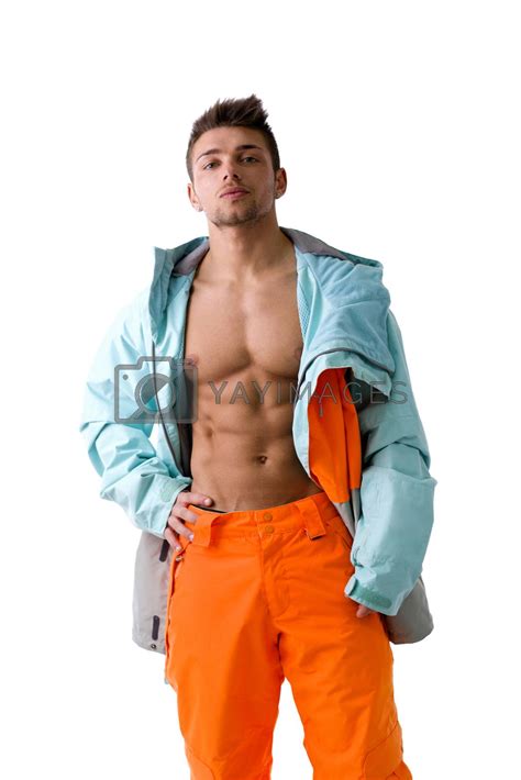Muscular Skier Or Snowboarder With Open Jacket On Naked Torso By