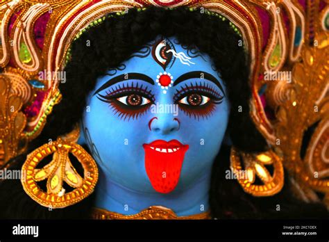 An Artisan Gives A Final Touches To An Idol Of The Goddess Durga Ahead